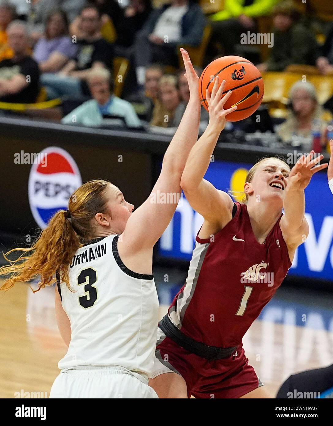 Washington State guard Tara Wallack (1) is fouled by Colorado guard ...