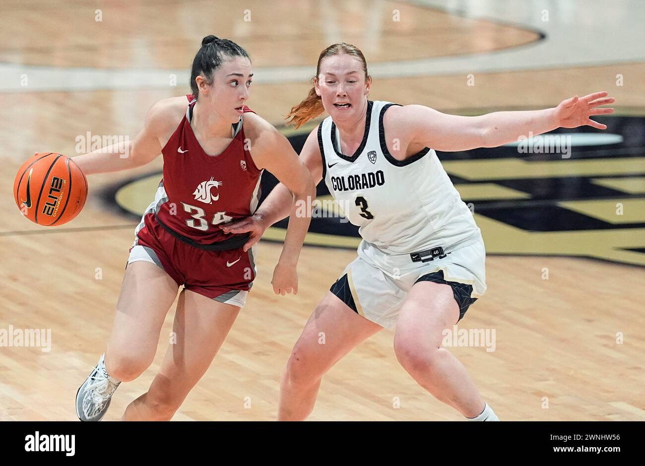 Washington State guard Jenna Villa (34) drives past Colorado guard ...