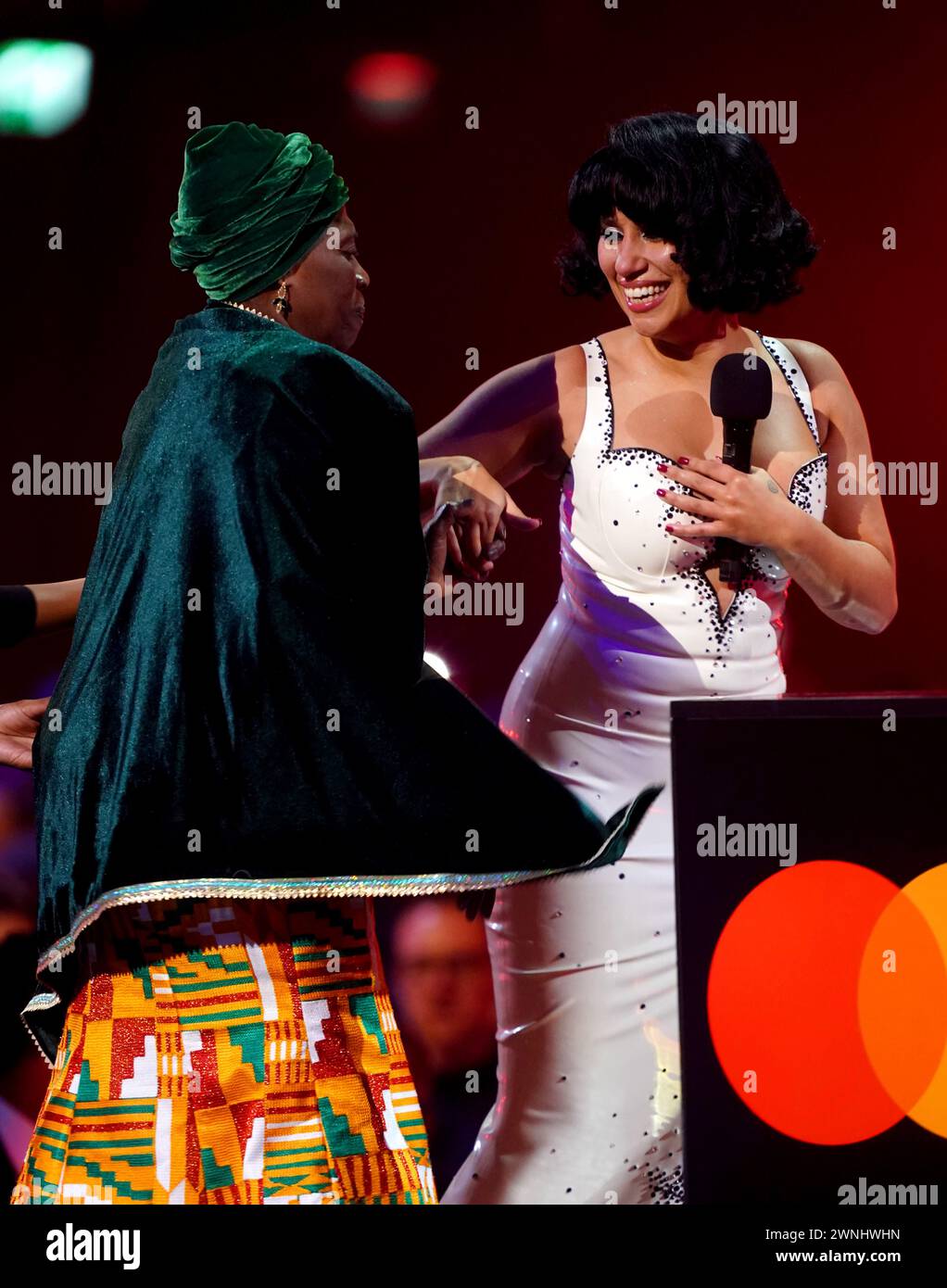 Raye (right) on stage with her grandmother after winning the Mastercard ...