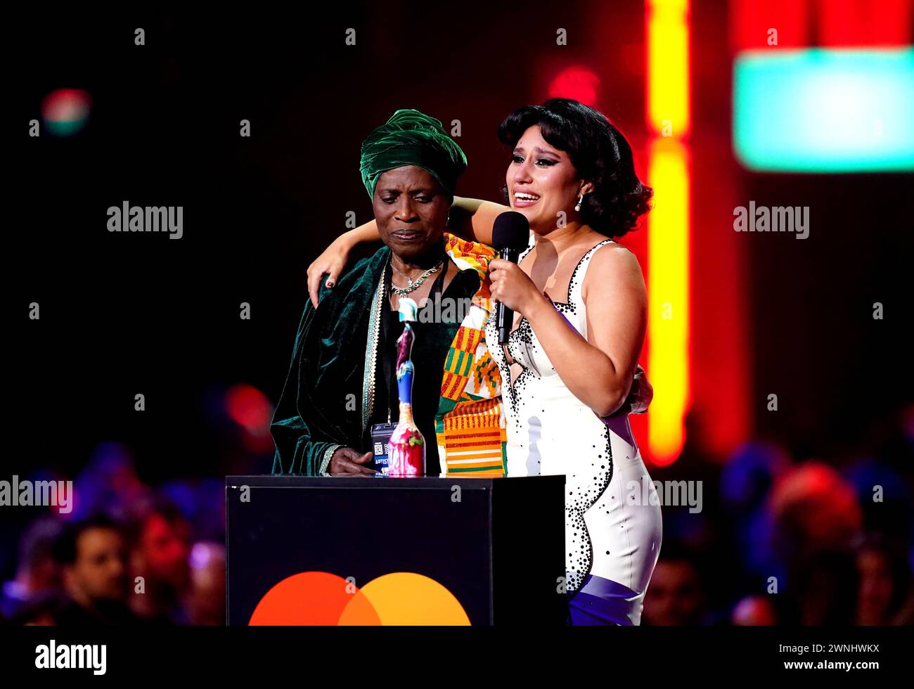 Raye (right) on stage with her grandmother after winning the Mastercard ...