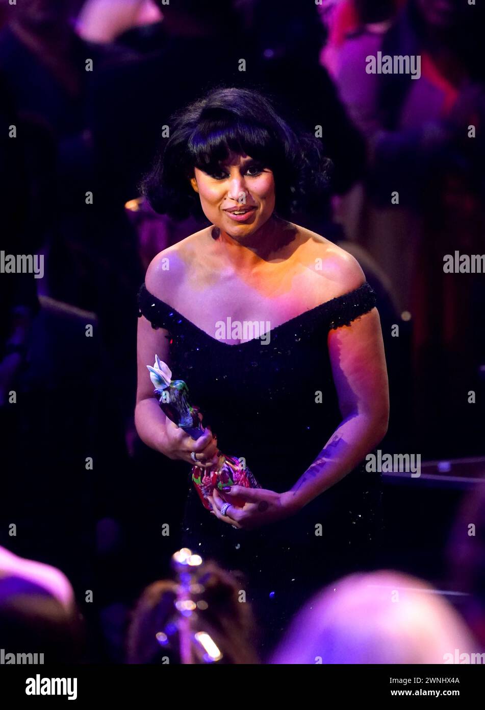 Raye leaves the stage after winning the award for Best New Artist ...
