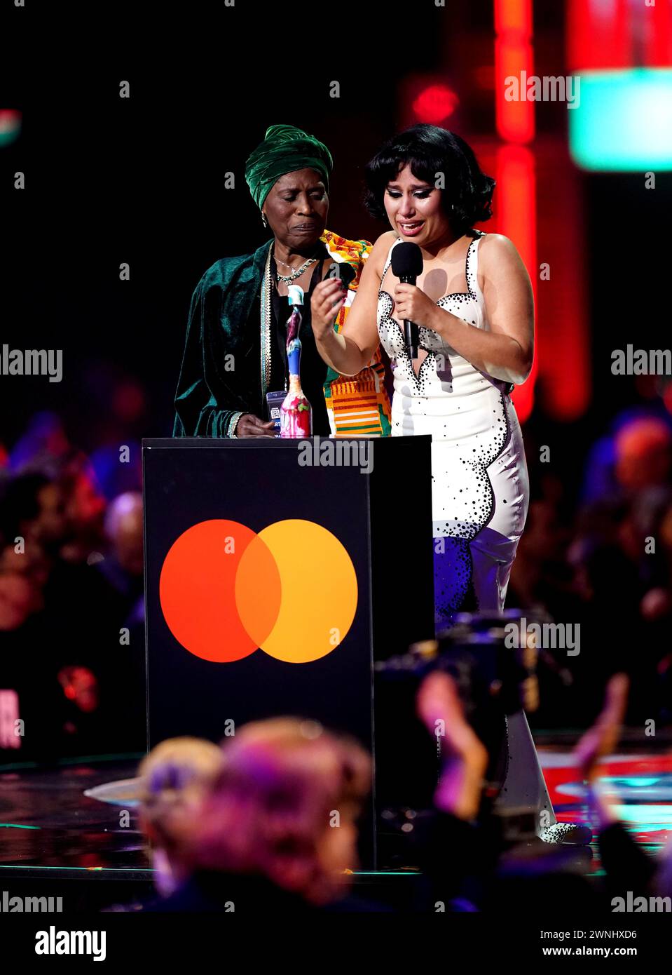 Raye (right) on stage with her grandmother after winning the Mastercard ...