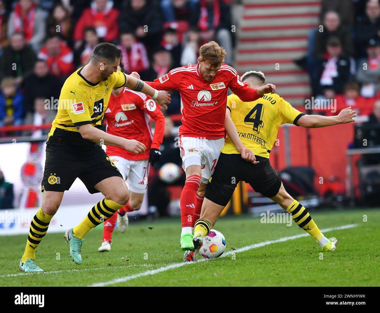 Berlin, Germany. 2nd Mar, 2024. Yorbe Vertessen (2nd R) of Union Berlin ...