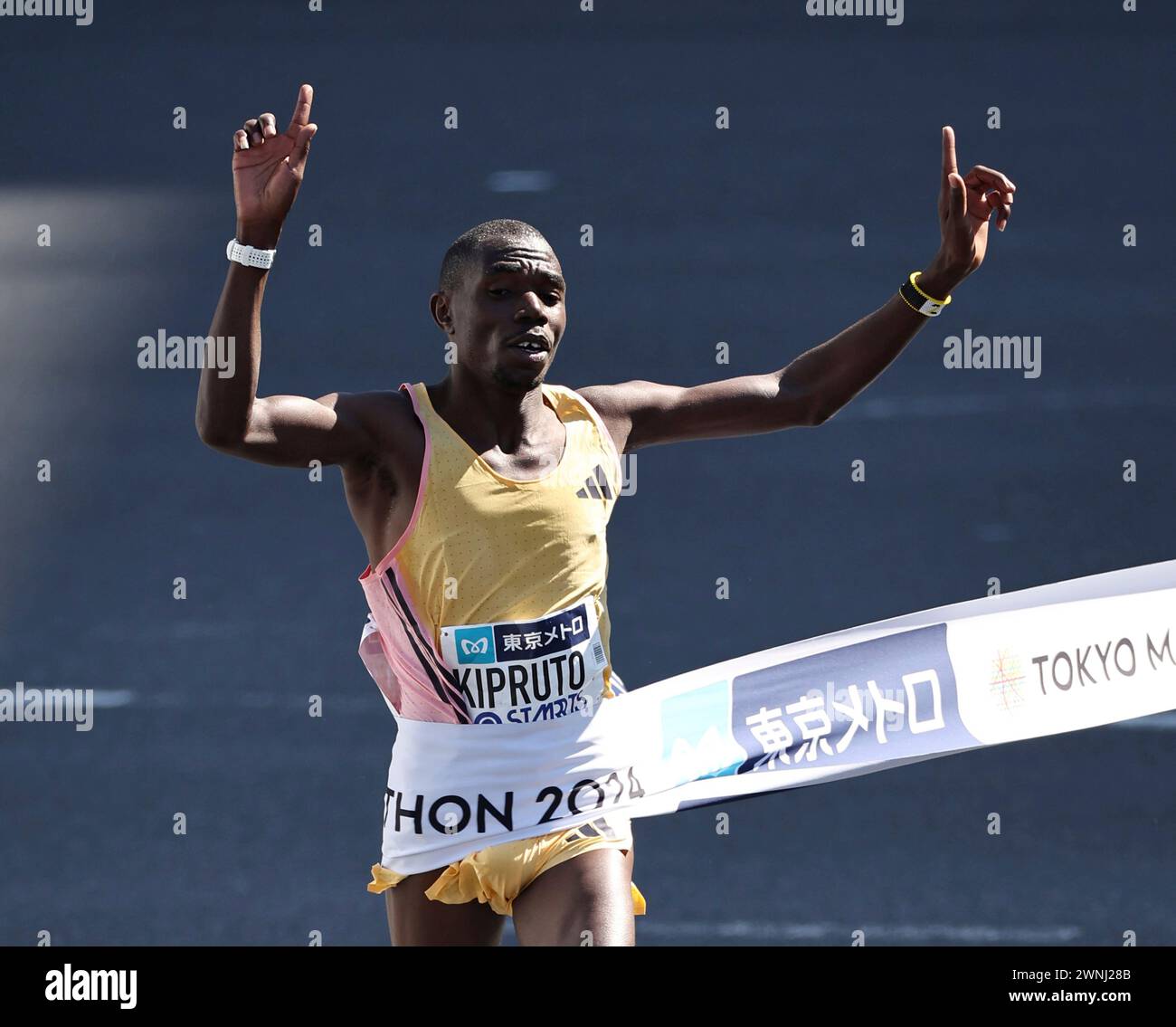 Vincent Kipruto of Kenya crosses the finish line during men's Tokyo Marathon 2024 in Chiyoda ...