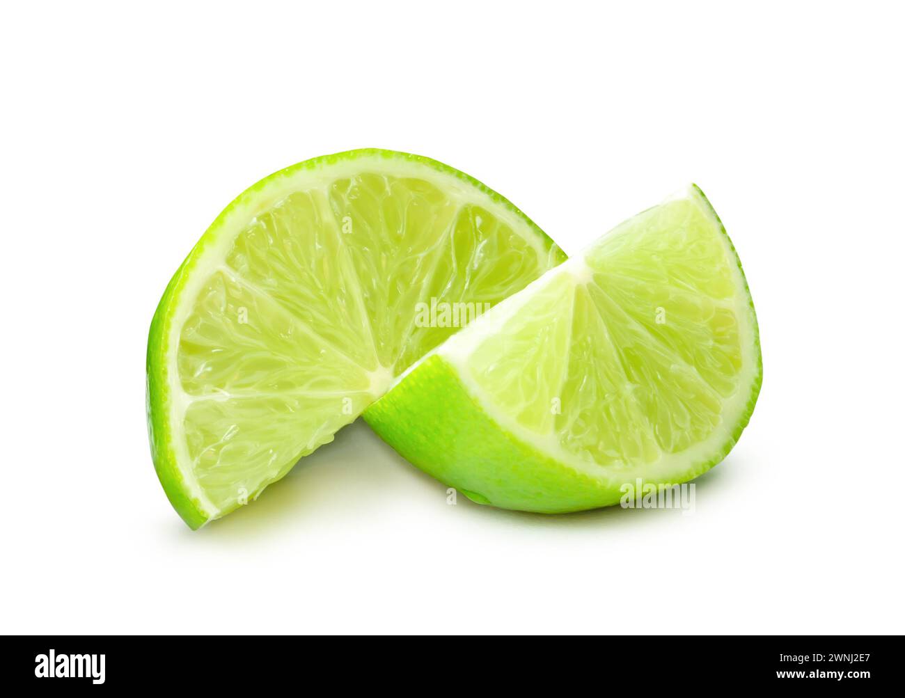 Front view of fresh green lemon fruit in slices or quarters is isolated on white background with ...