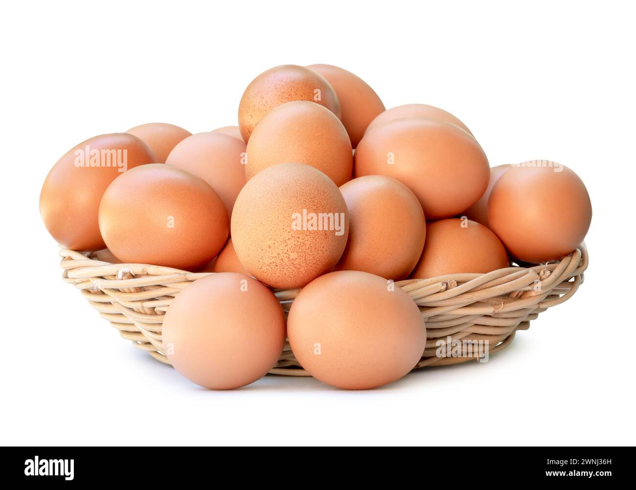 Front view of fresh brown chicken eggs in stack in woven bamboo basket ... Front view of fresh brown chicken eggs in stack in woven bamboo basket ...