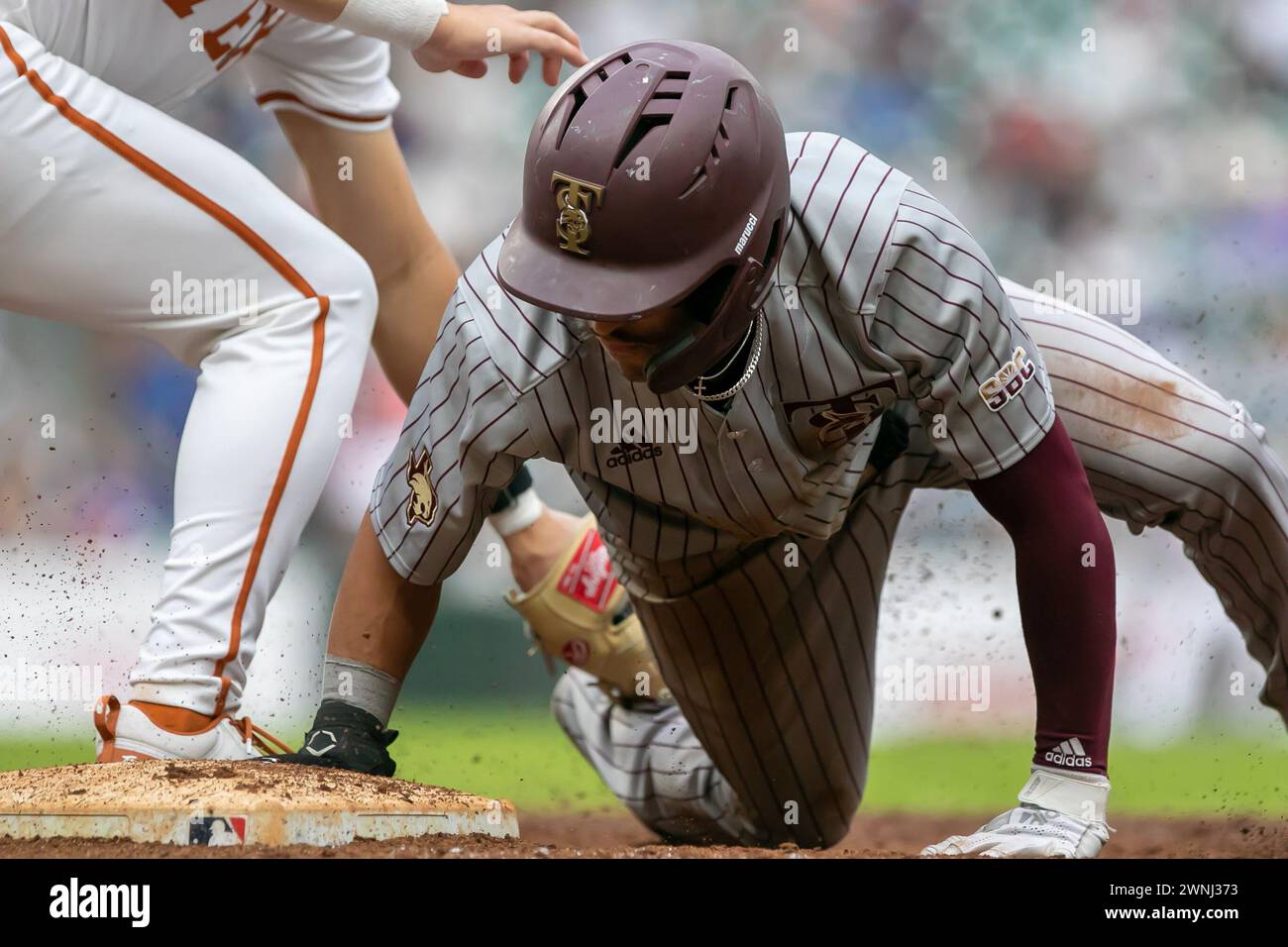 Houston, Texas, USA. 2nd Mar, 2024. Texas State infielder AARON LUGO (1) gets back to first ...