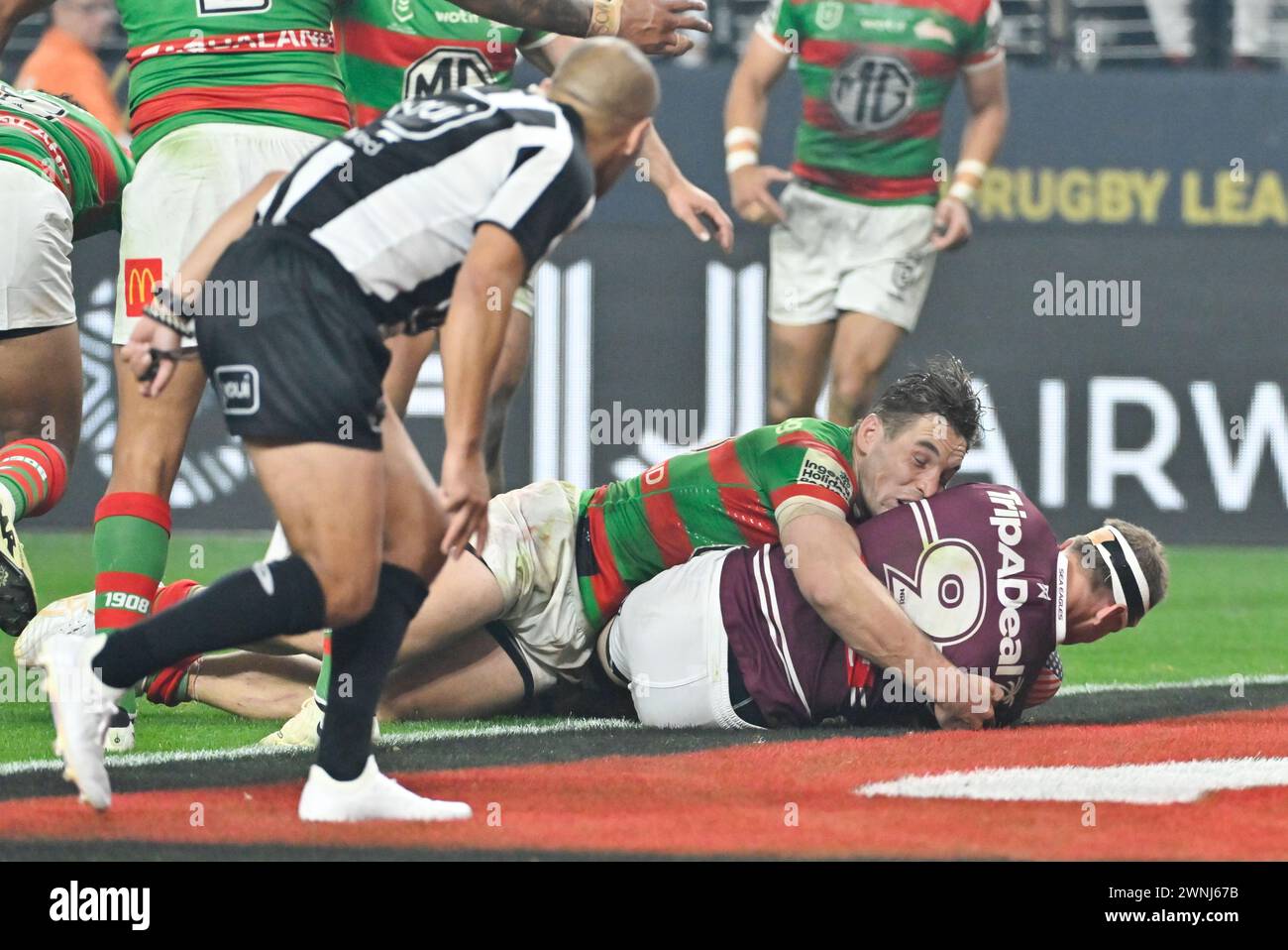 Sea Eagles Lachlan Croker, right, scores a try in the tackle of ...