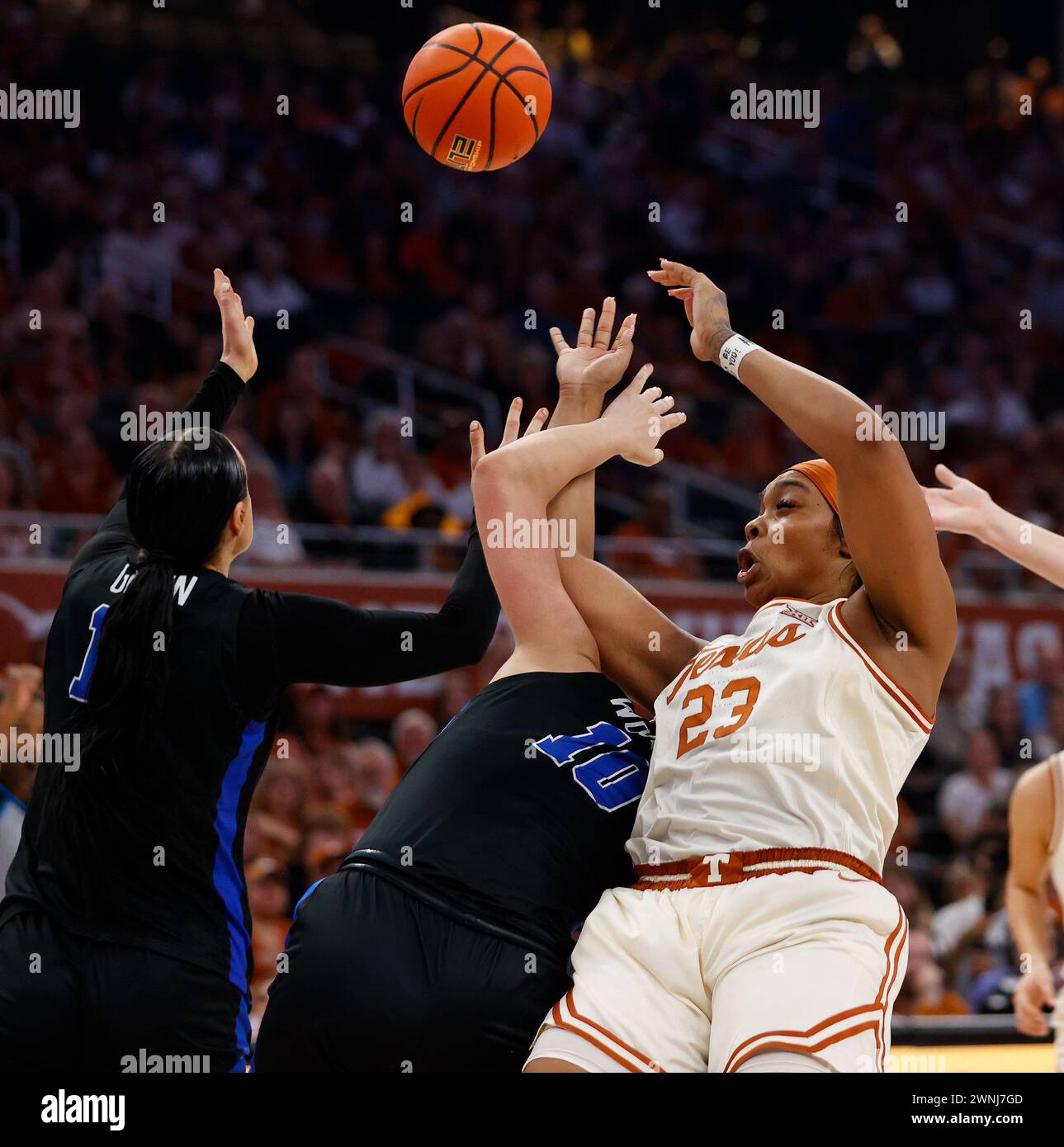 March 2, 2024: Texas forward Aaliyah Moore (23) gets tangled with BYU ...