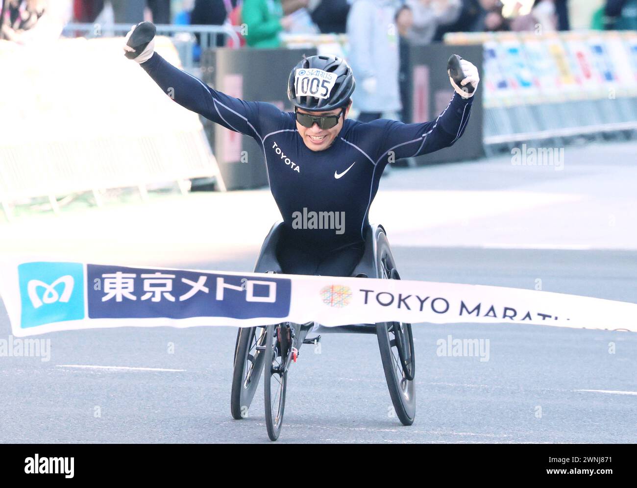 Tokyo, Japan. 3rd Mar, 2024. Japan's Tomoki Suzuki crosses the finish line of the Tokyo Marathon ...