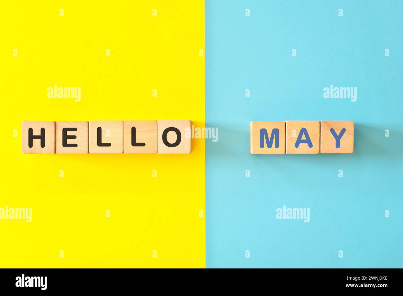 Hello month of May concept. Wooden blocks typography in bright blue and ...