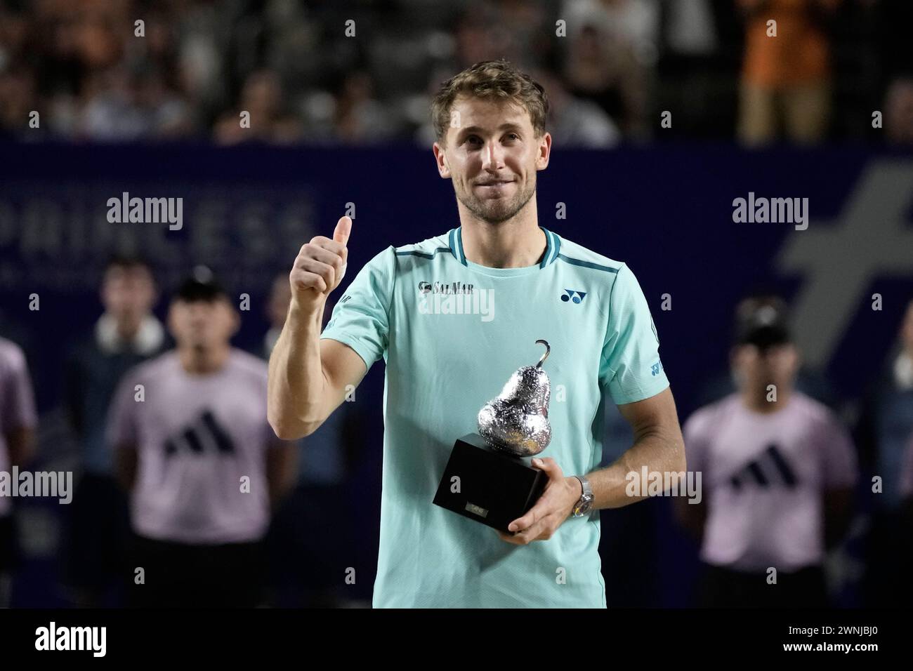 Casper Ruud of Norway poses with his second place trophy after losing ...