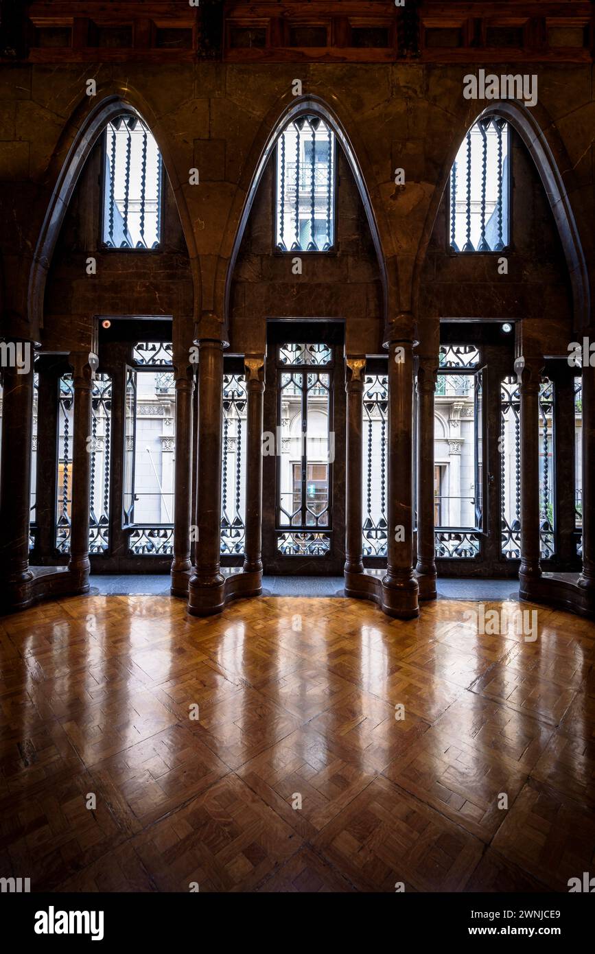 Windows and columns with parabolic arches on the main floor of Palau ...