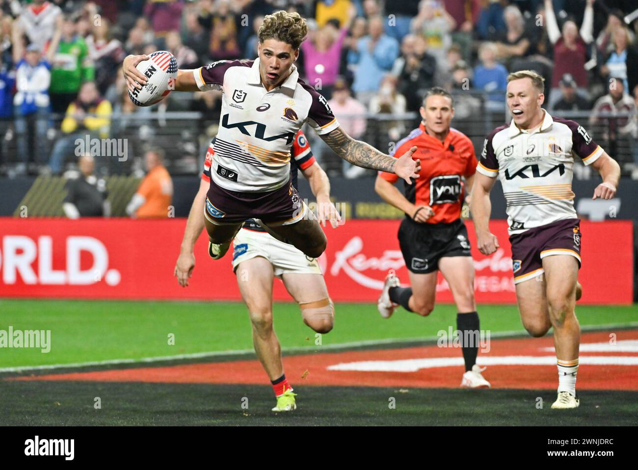 Broncos Reece Walsh is airborne as he scores a try during the NRL match ...