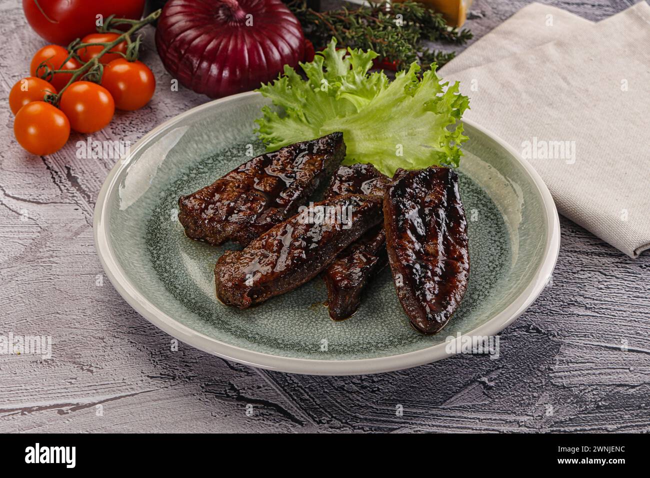 Grilled diet beef liver steak in the plate Stock Photo - Alamy