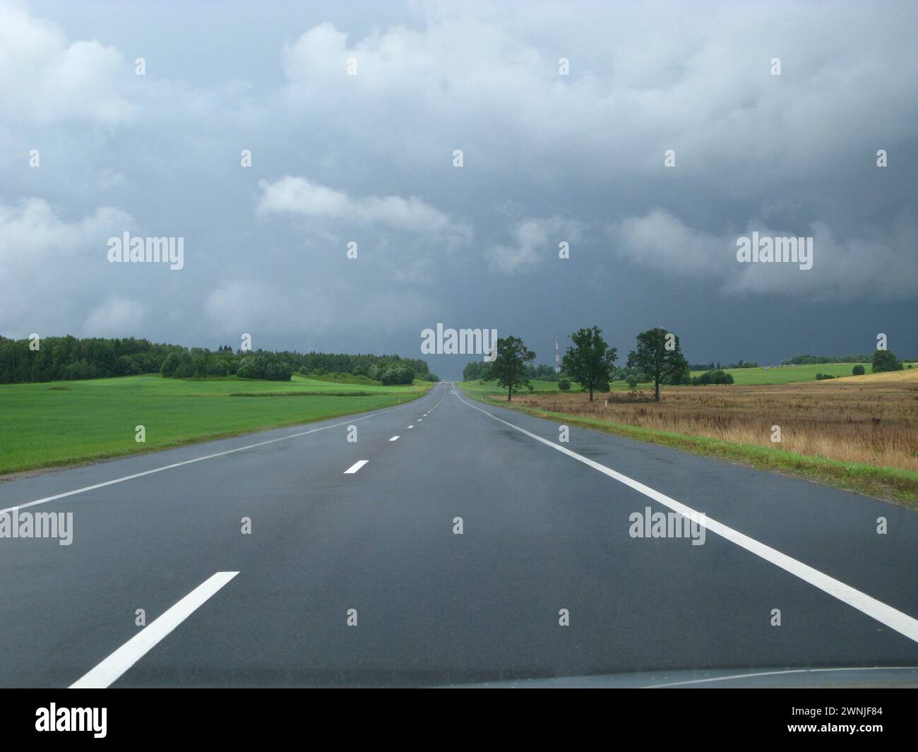 The road on fields of Lithuania Stock Photo - Alamy