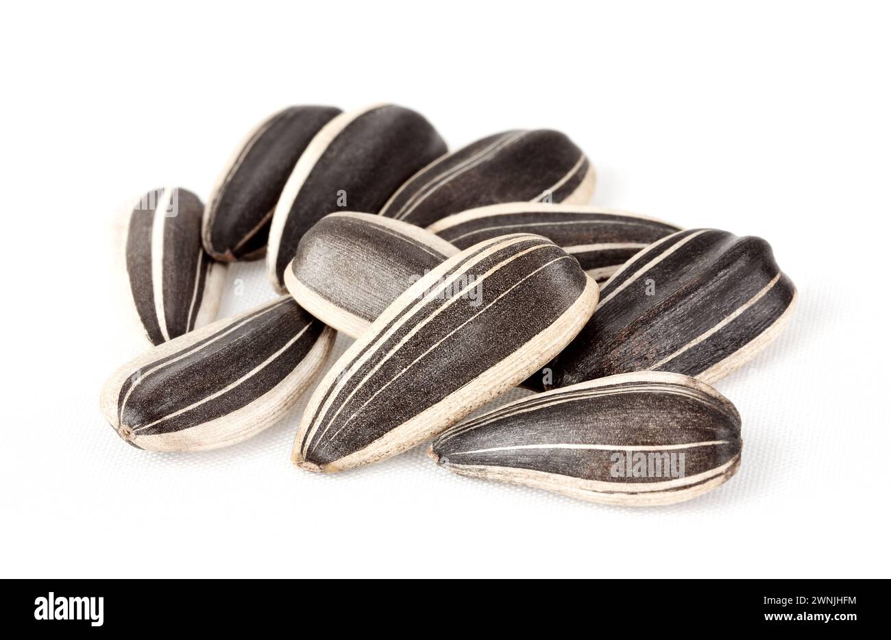 sunflower seeds isolated white background Stock Photo - Alamy