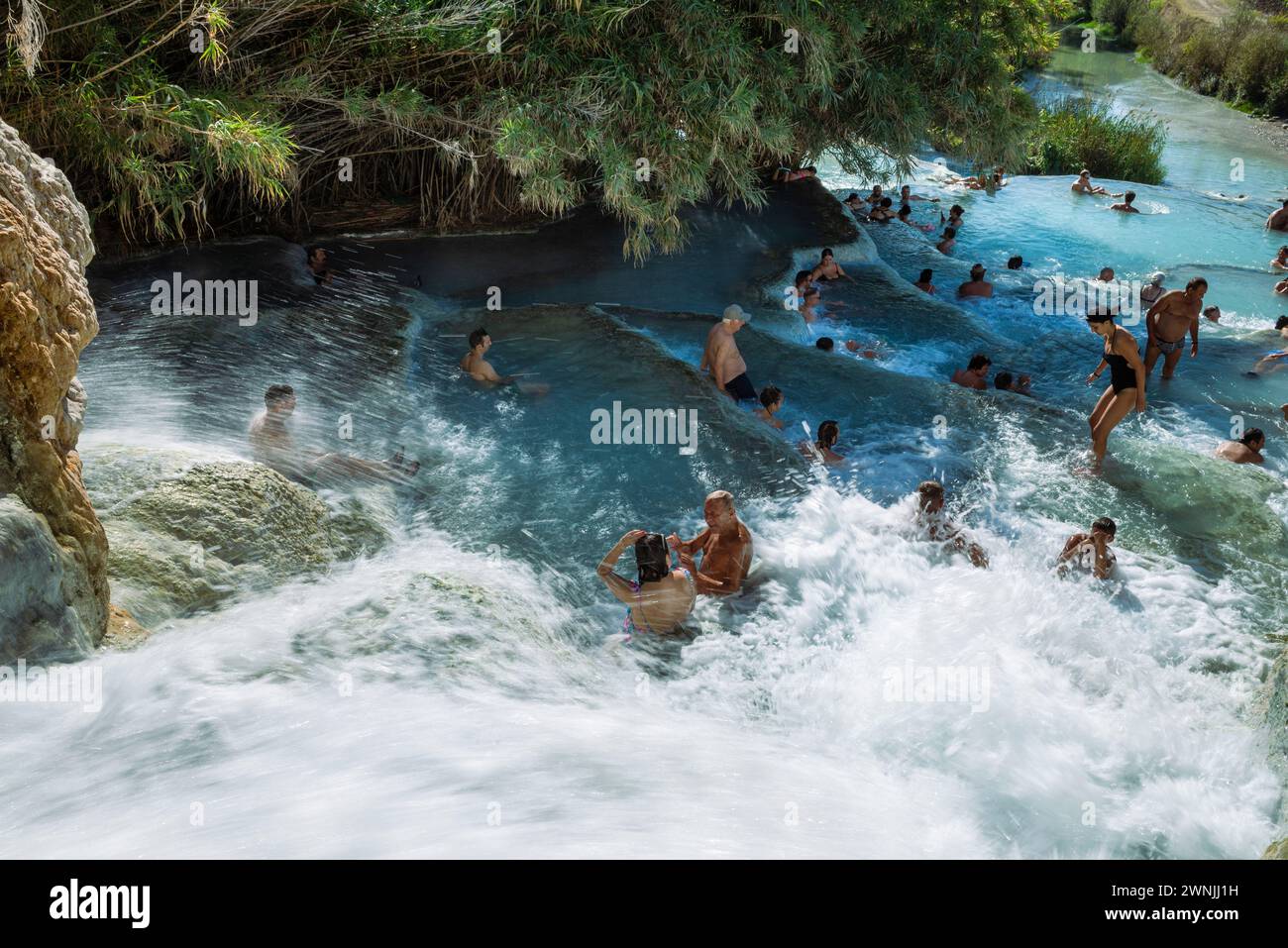 Water cascades from the hot thermal springs of Saturnia, Tuscany, Italy ...