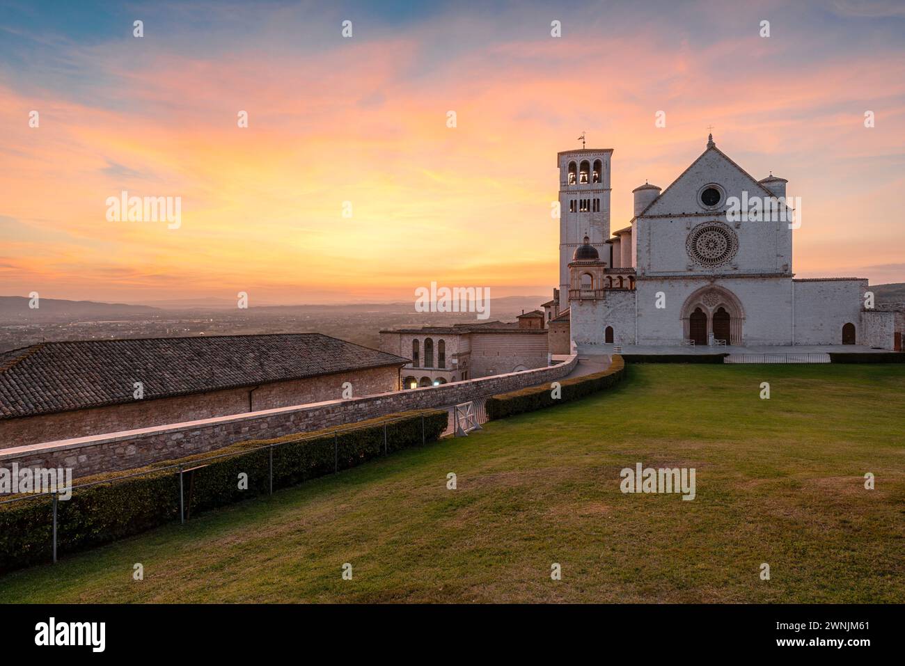 The Basilica of St Francis of Assisi and Umbra valley at sunset, Umbria ...