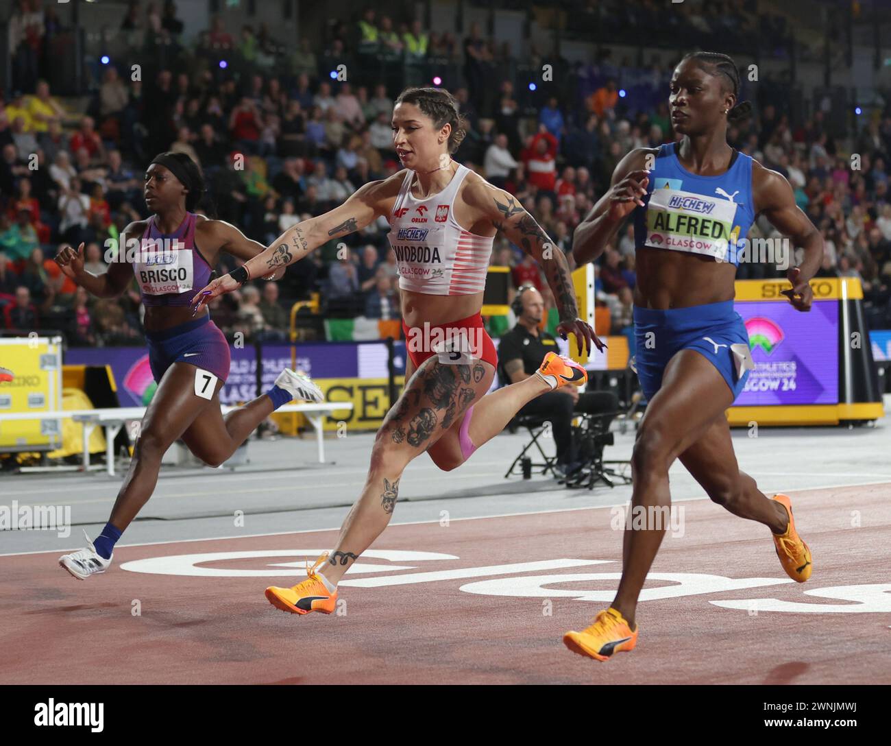 Glasgow, Britain. 2nd Mar, 2024. Julien Alfred (R) of Saint Lucia and Ewa Swoboda (C) of Poland ...