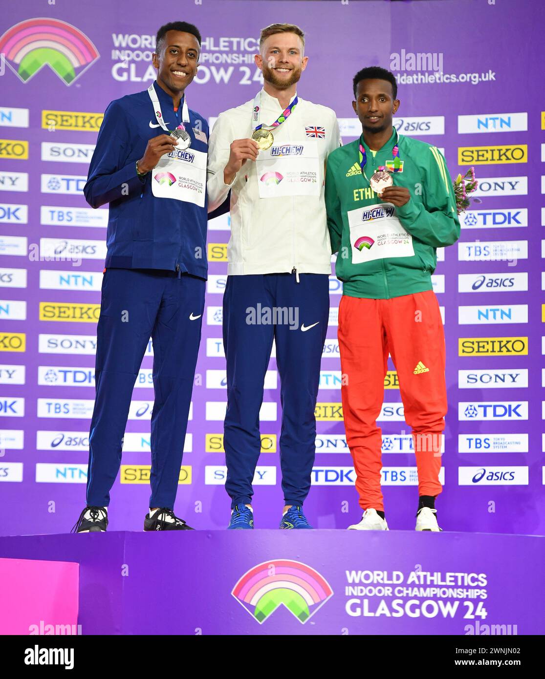 Glasgow, Britain. 2nd Mar, 2024. Gold medalist Josh Kerr (C) of Britain ...
