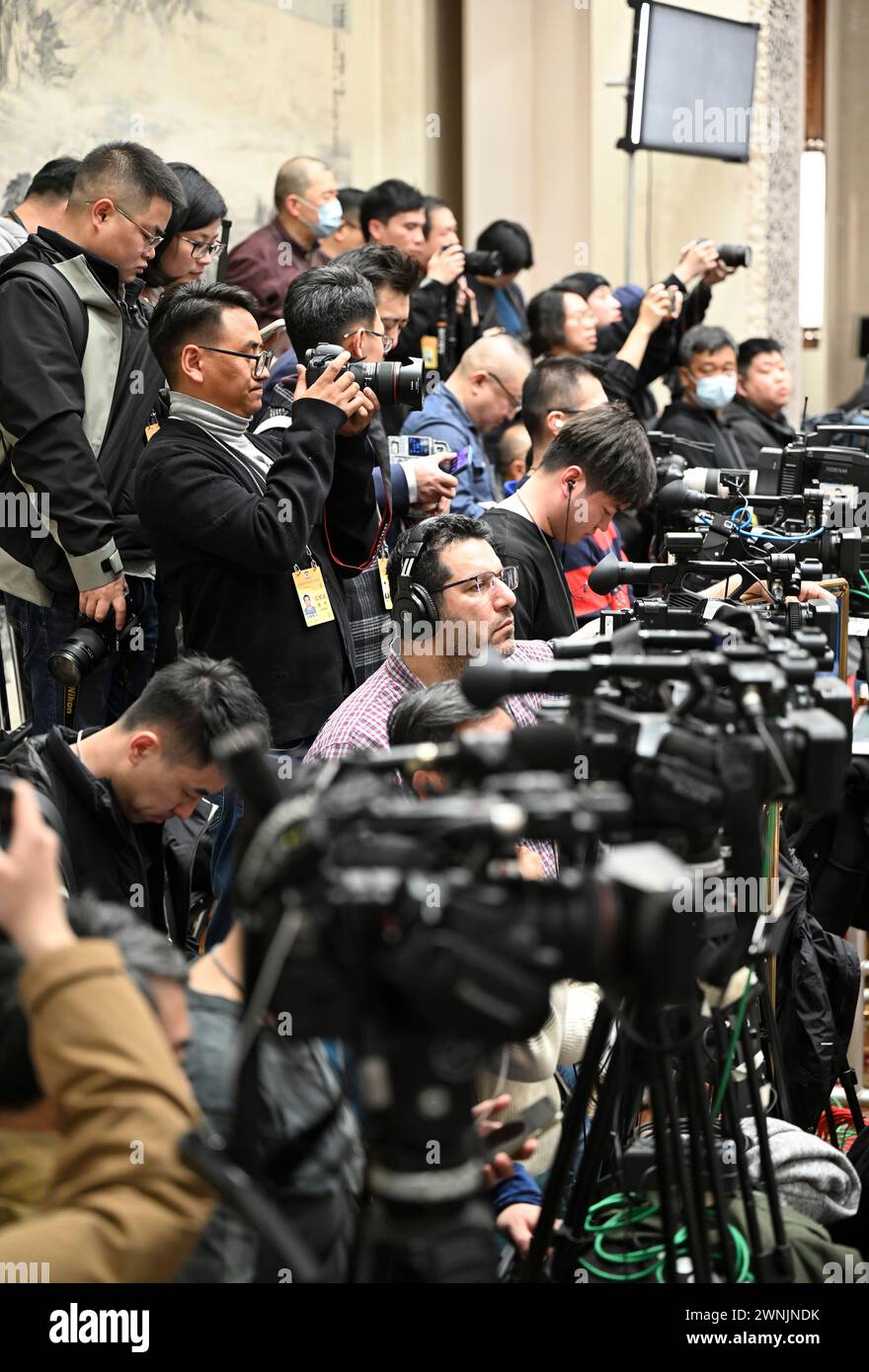 Beijing, China. 3rd Mar, 2024. Journalists work at a press conference ...