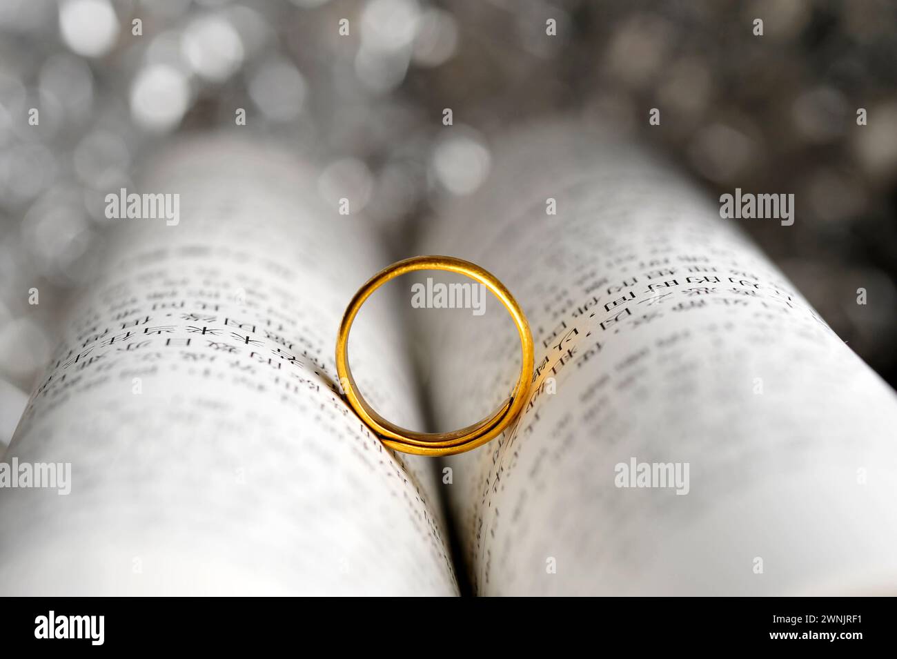 Ring in open book Stock Photo - Alamy