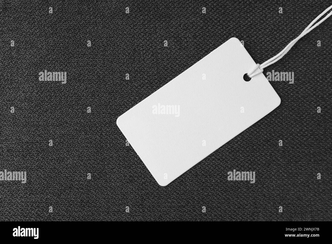 Textile background, black coarse fabric texture with white empty ...