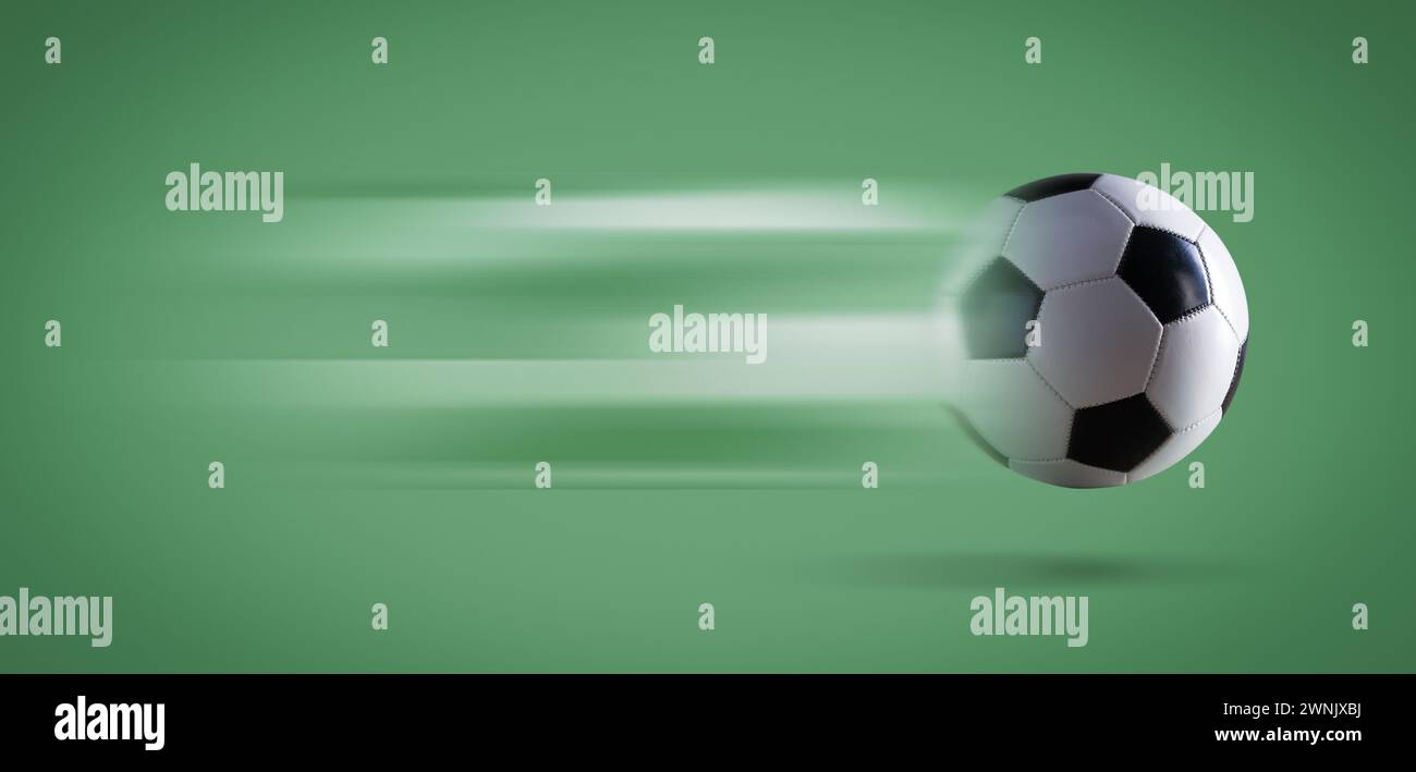 Fast soccer ball on green background, sports and championships concept ...