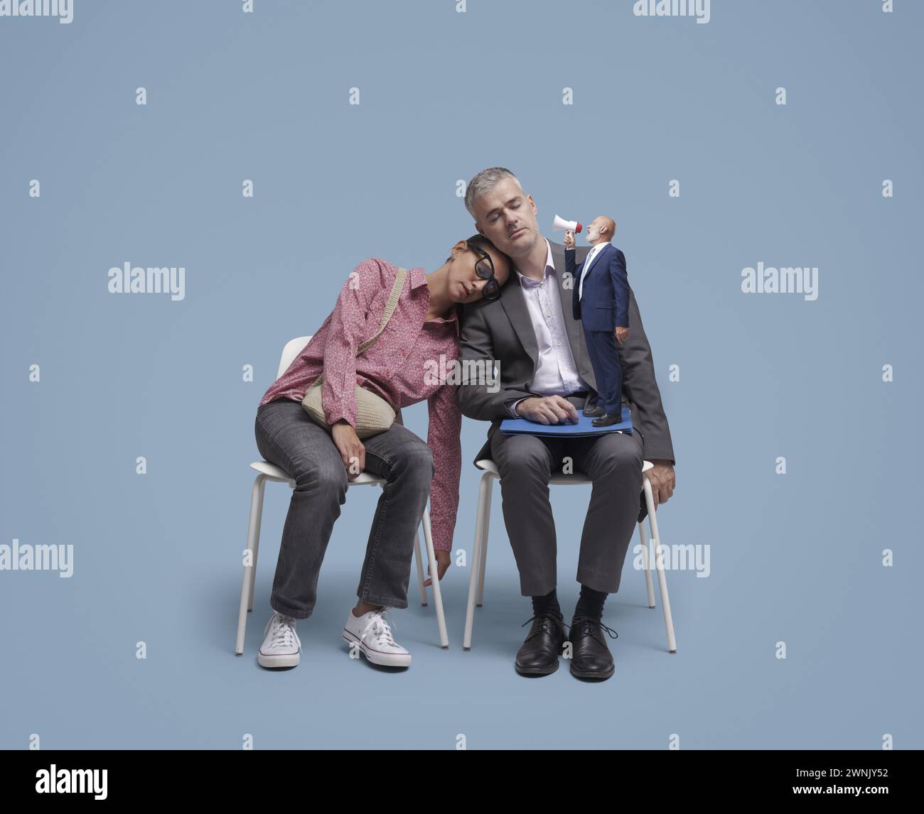 Tiny boss shouting and giving orders to his employees using a megaphone ...