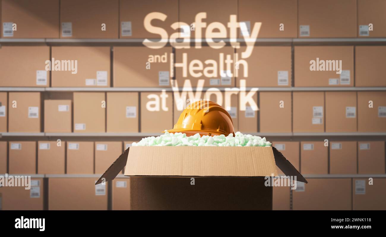 Safety and health at work: protective safety helmet in a delivery box ...
