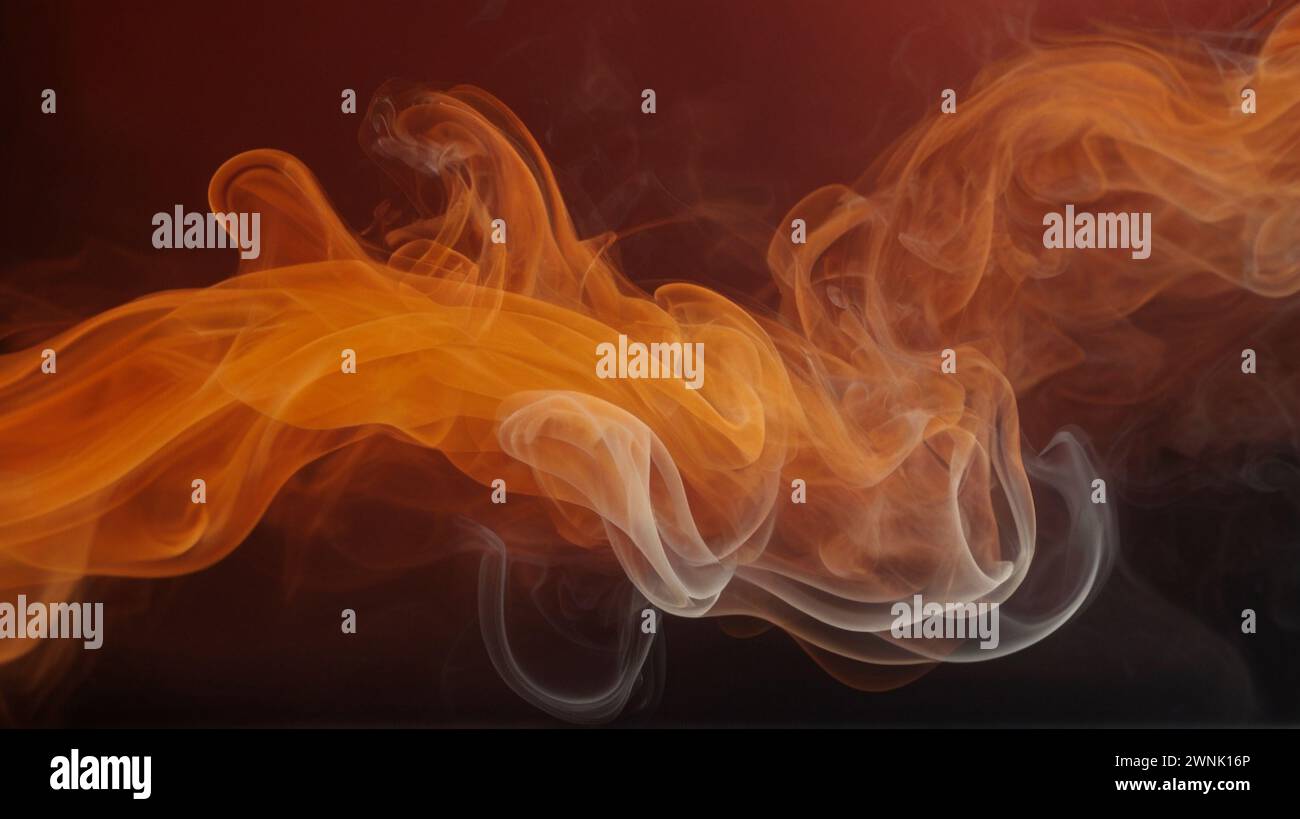 Orange smoke with a dark background Stock Photo - Alamy