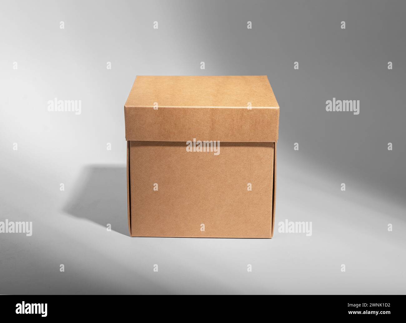 Kraft carton box of cube shape, cardboard package Stock Photo - Alamy