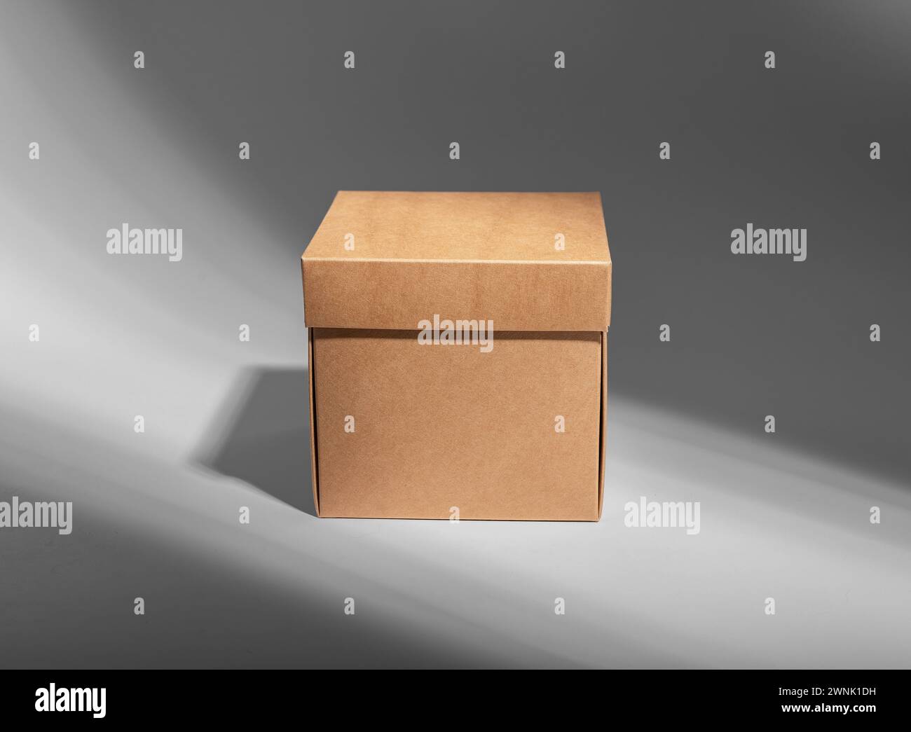 Kraft carton box of square shape, cardboard package Stock Photo - Alamy