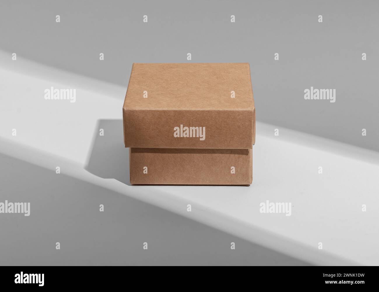 Kraft carton box of square shape, small little cardboard package Stock ...