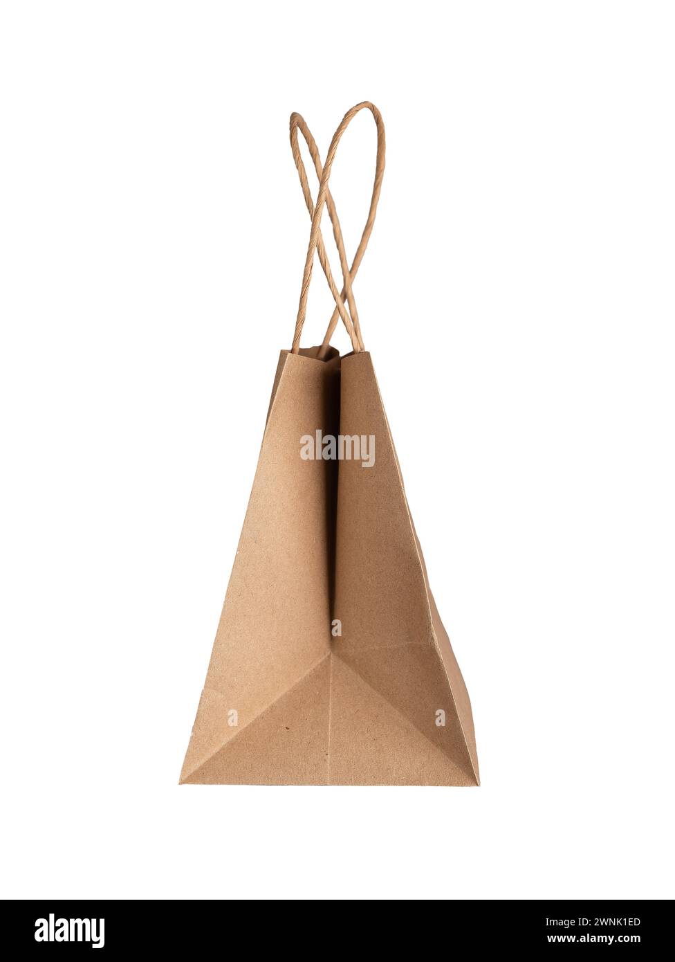 Kraft craft paper bag with handles, side view, isolated on white ...