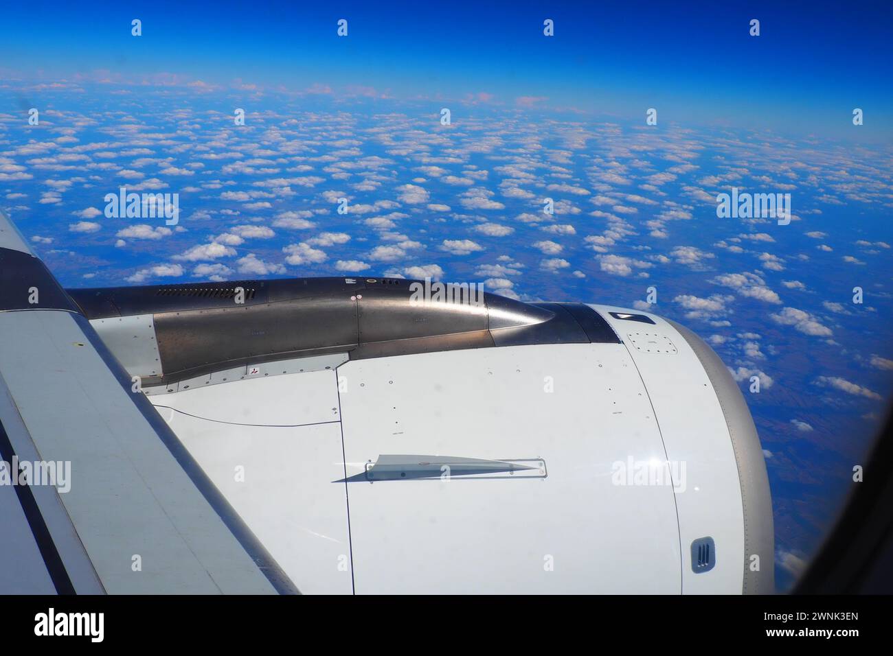 Aircraft engine and wing on the border of atmosphere and space. The ...