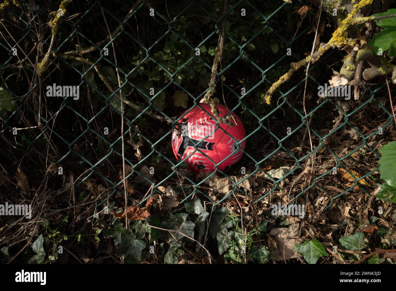 Nike Pitch football behind a school fence Stock Photo - Alamy