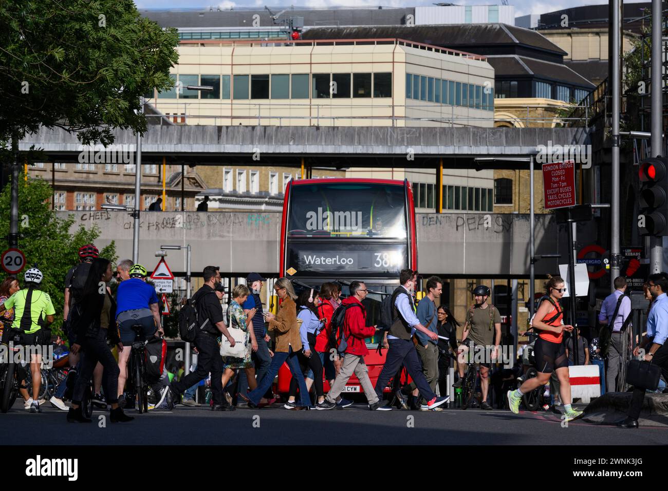 Pedestrians using a pelican crossing to cross Tooley Street during the ...