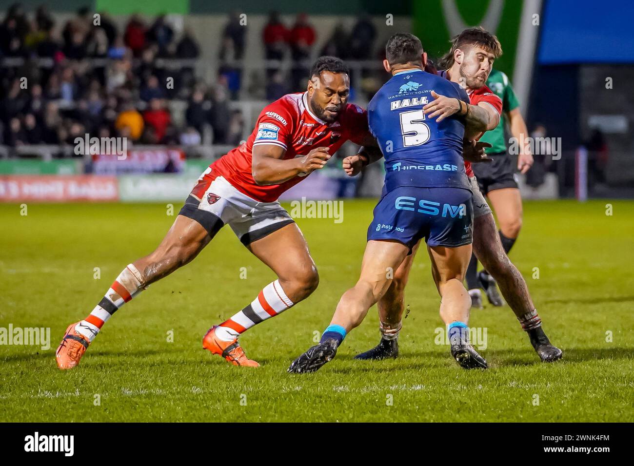 JOE SHORROCKS & KING VUNIYAYAWA tackle Ryan Hall. Salford Red Devils Vs ...