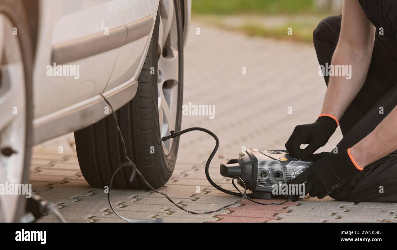 Man using air pump hi-res stock photography and images - Alamy