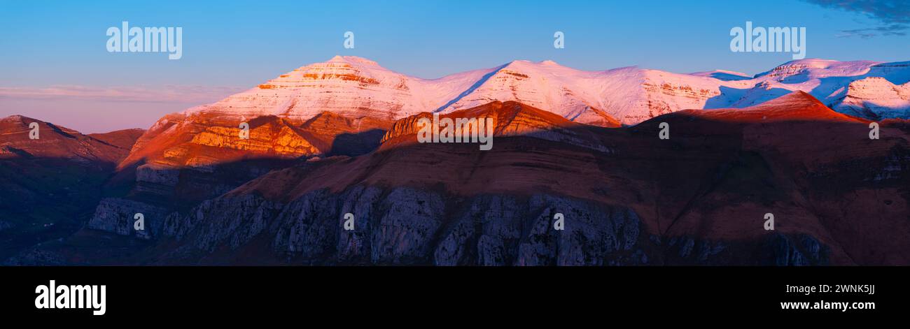 Last lights of the peaks of the Miera Valley in winter, aerial view of ...