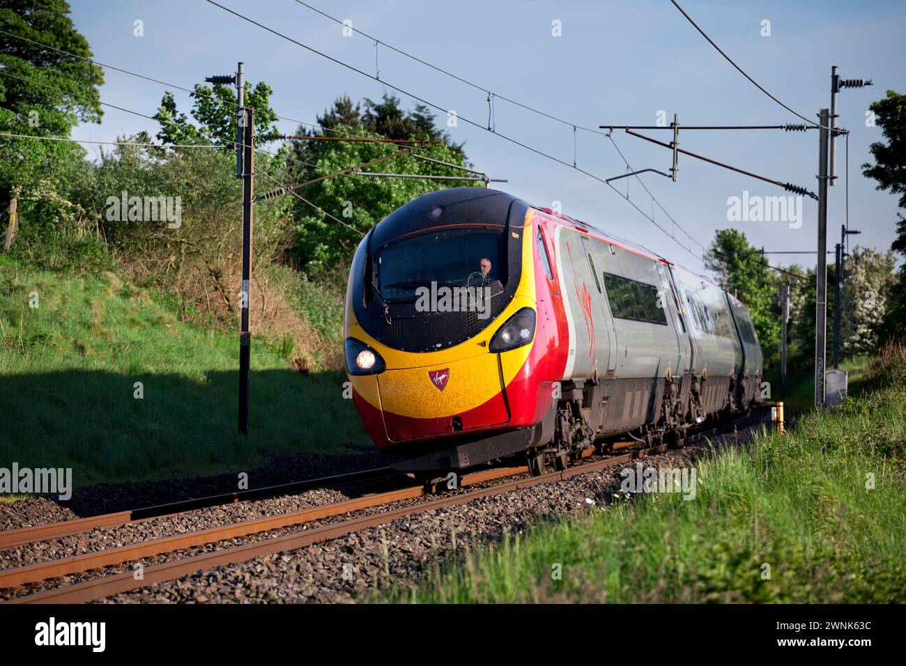 Virgin trains pendolino train tilting round a curve on the west coast ...