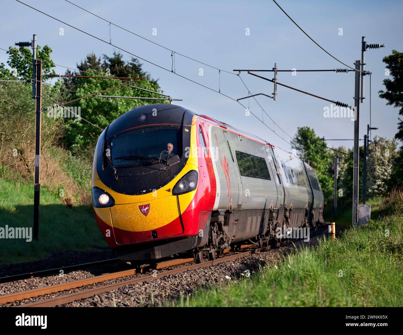 Virgin trains pendolino train tilting round a curve on the west coast ...