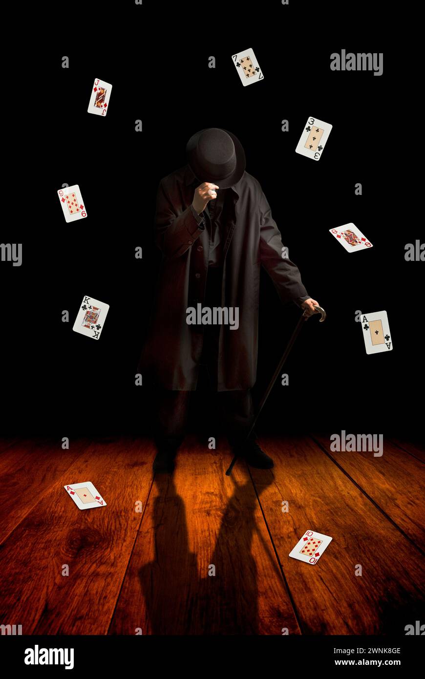 magician with playing cards floating around him Stock Photo - Alamy