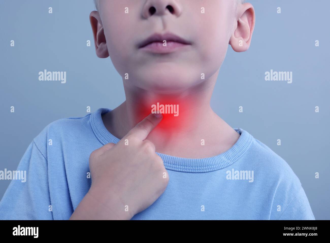 Endocrine system. Boy doing thyroid self examination on light blue ...
