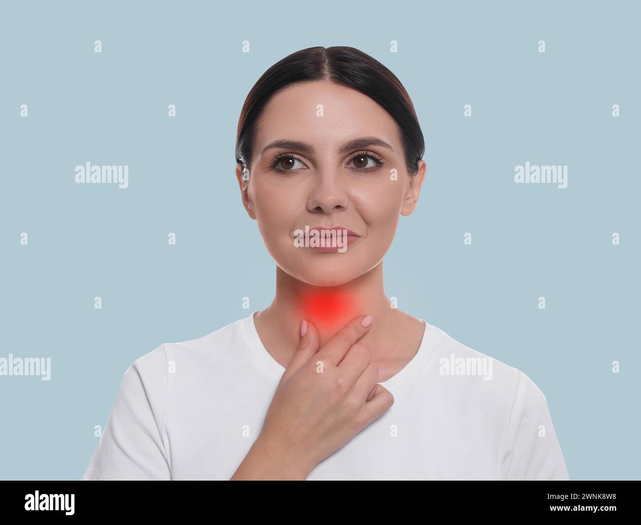 Endocrine system. Woman doing thyroid self examination on light blue ...