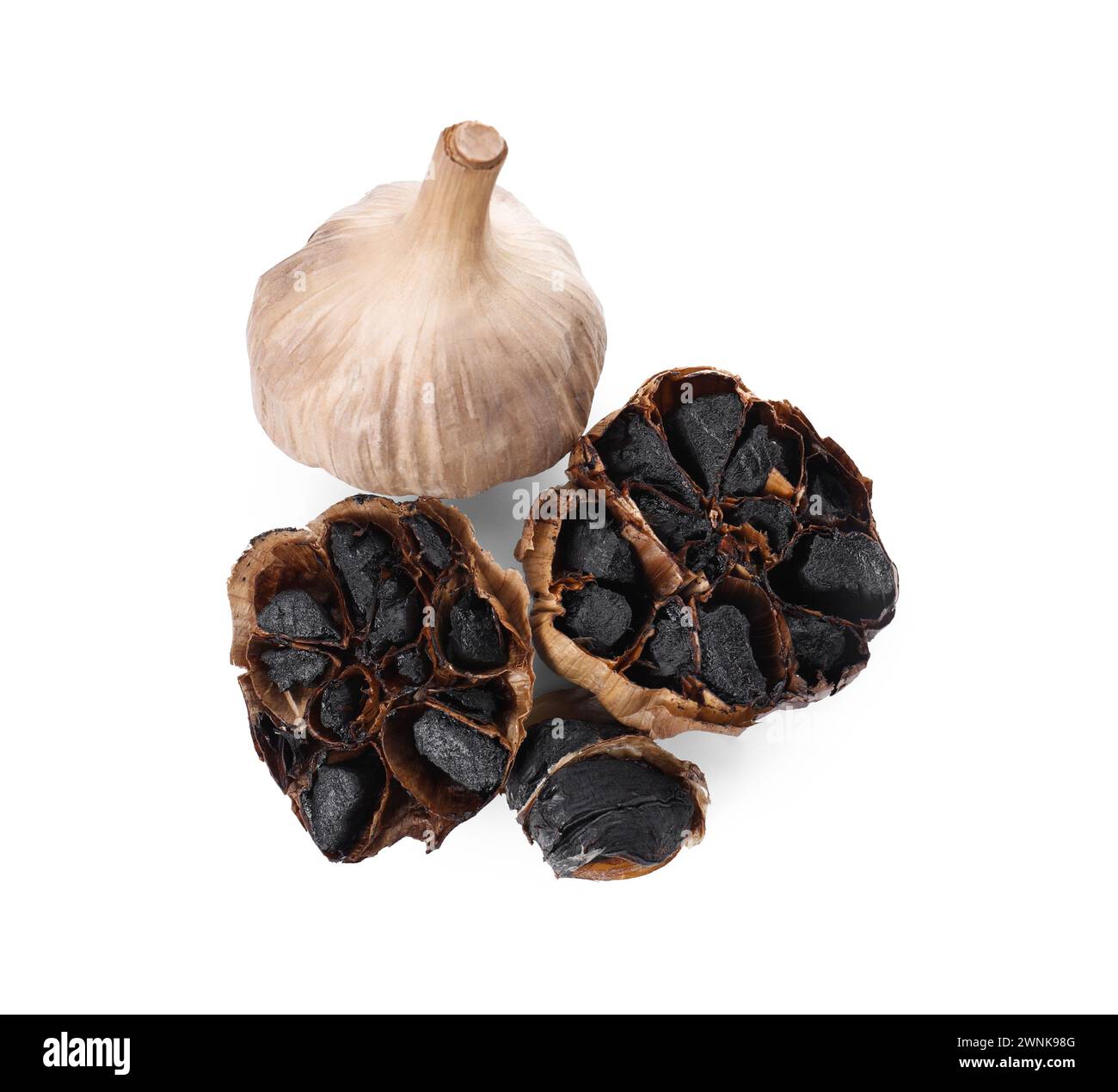 Black fermented garlic on white Cut Out Stock Images & Pictures - Alamy