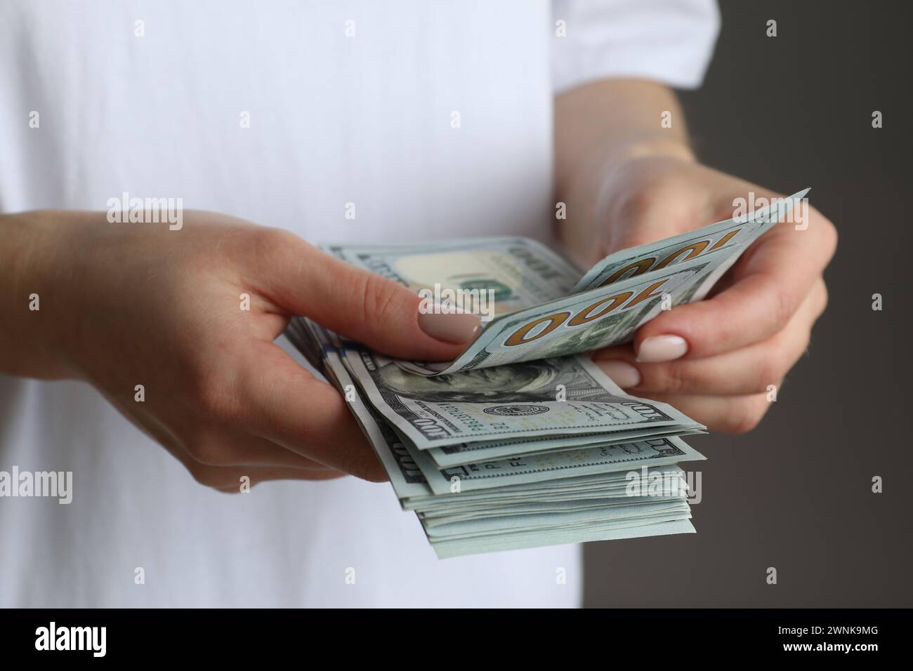 100 dollar banknotes counting hand hi-res stock photography and images ...