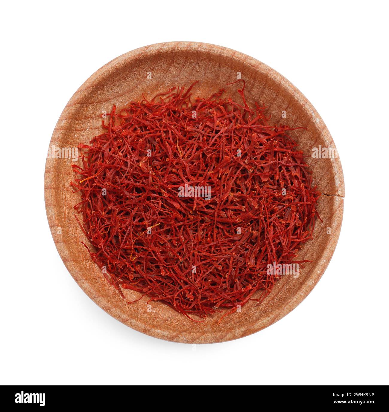 Aromatic saffron in bowl isolated on white, top view Stock Photo - Alamy
